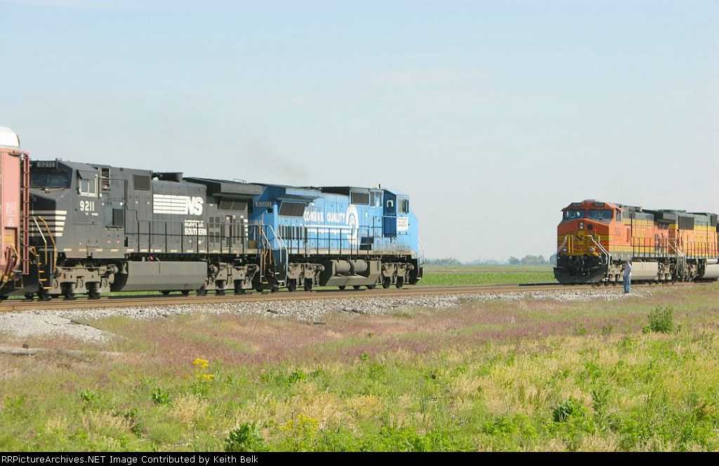 NS 8380 and 9211 passing BNSF 5039